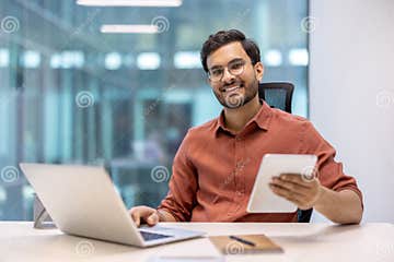 Indian Programmer Working with Laptop and Tablet in Modern Office Stock ...