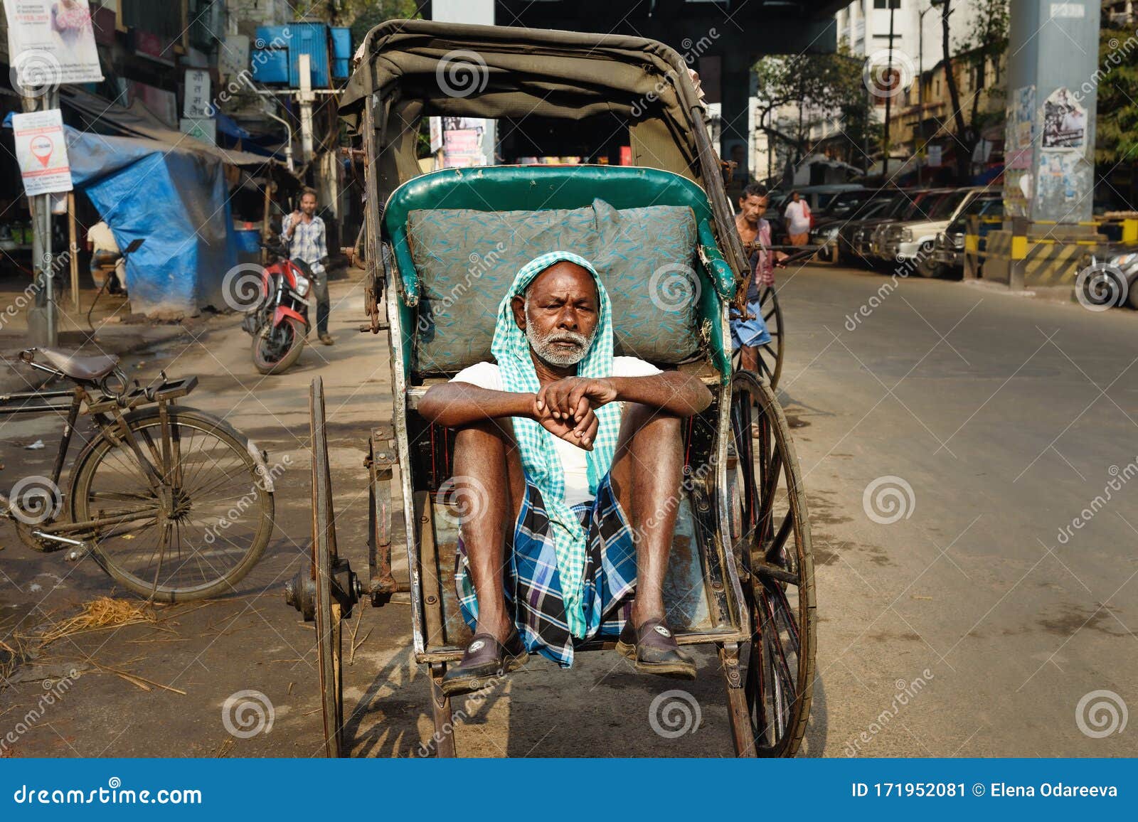 Indian Rickshaw Puller Sitting on His Rickshaw and Waiting for ...