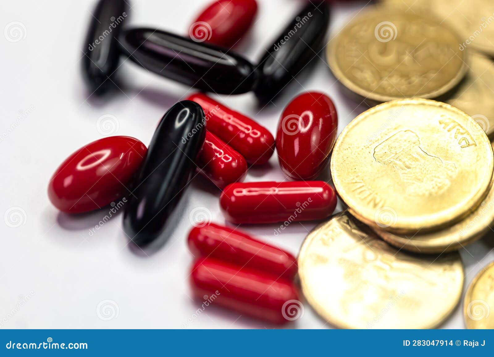 Indian 5 Rupees Coins and Red and Black Tablets Pills on White Backdrop ...