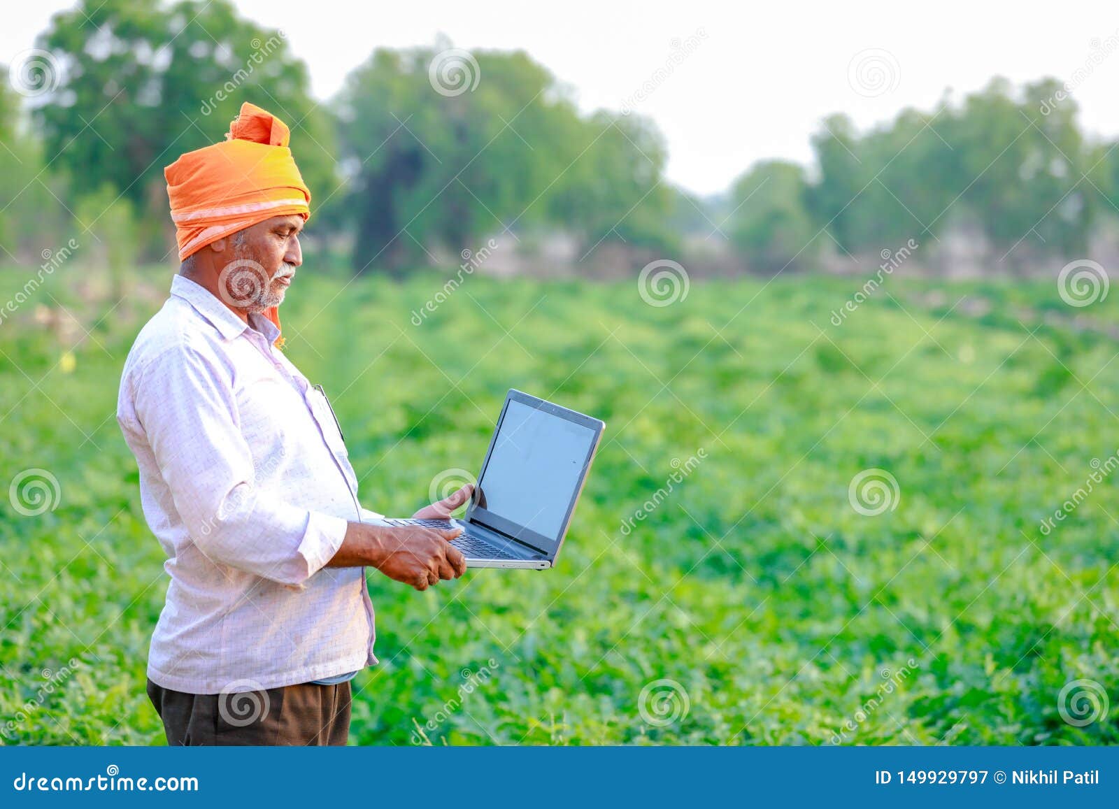 Indian Rural Farmer Using Laptop Stock Image - Image of kurta, fields ...