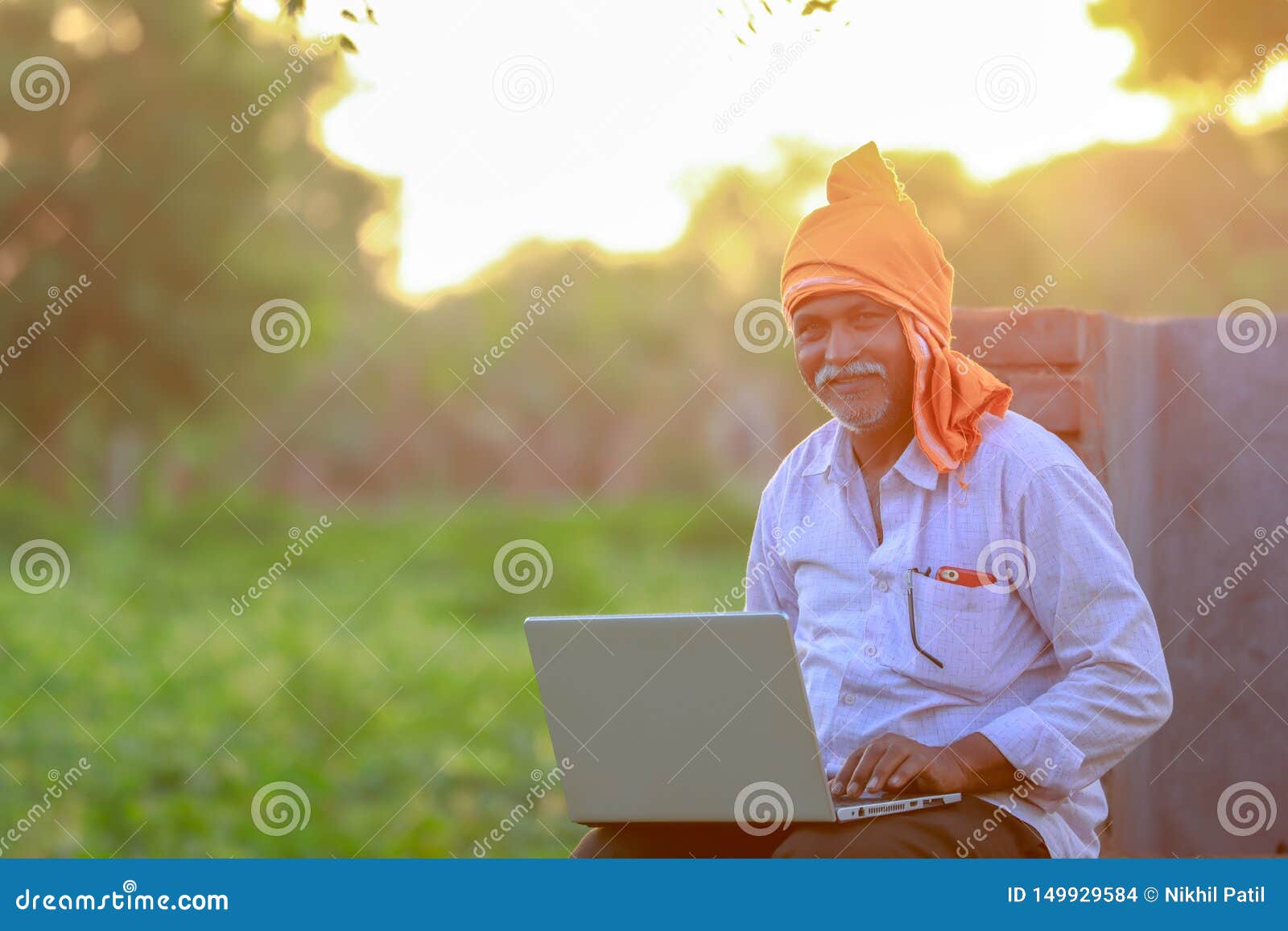 Indian Rural Farmer Using Laptop Stock Photo - Image of holding, crop ...