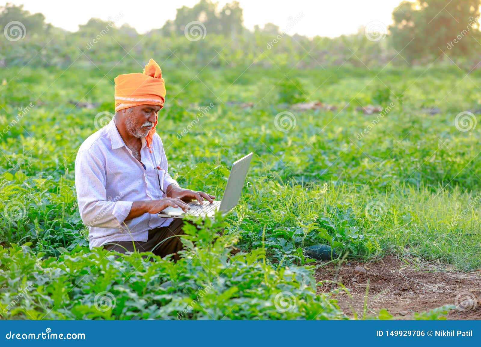 Indian Rural Farmer Using Laptop Stock Photo - Image of farmland ...