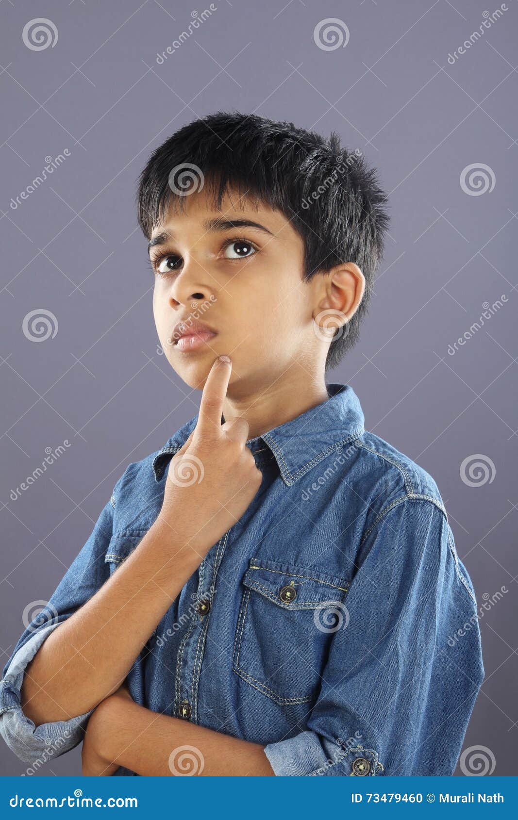 Indian School boy thinking stock photo. Image of little - 73479460