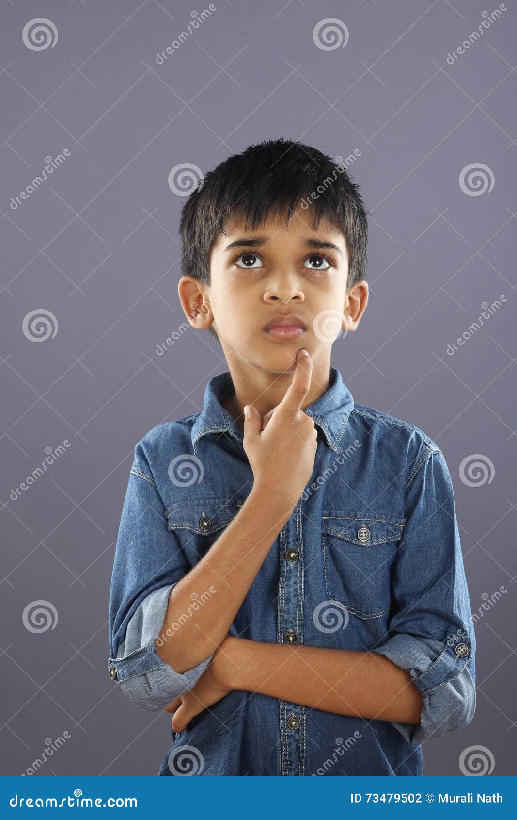 Indian School boy thinking stock photo. Image of pose - 73479502