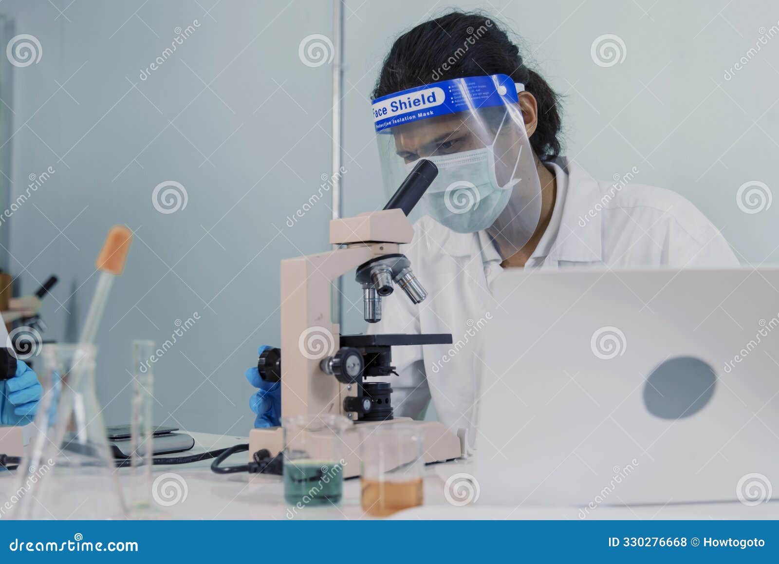 Indian Scientist Man Looking Microscope Using Laptop Analyze Research ...