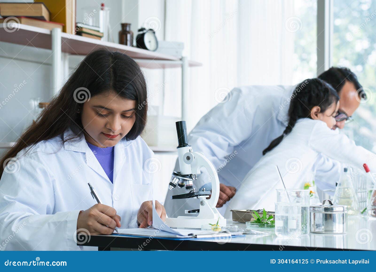 Indian Scientist Woman Student Using Microscope Do Experiment and ...