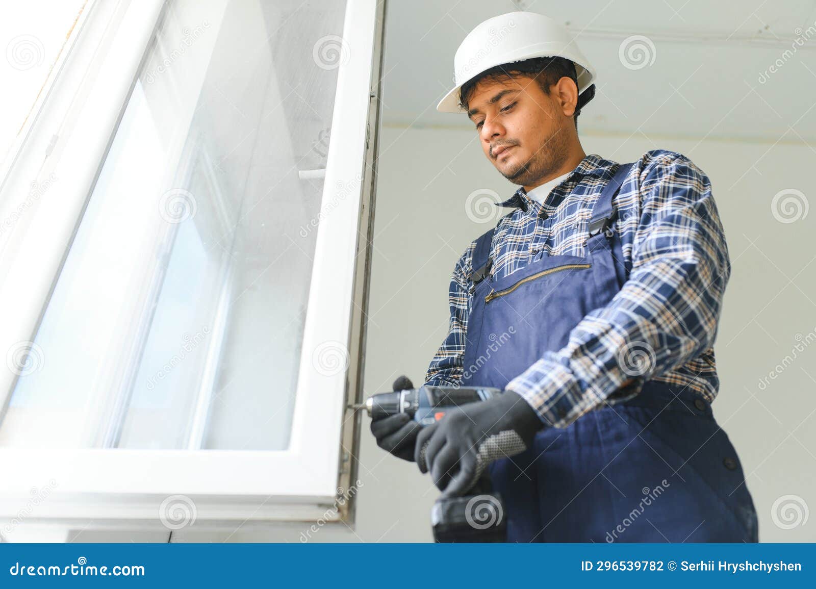 Indian Service Man Installing Window with Screwdriver Stock Photo ... Indian Service Man Installing Window with Screwdriver Stock Photo ...