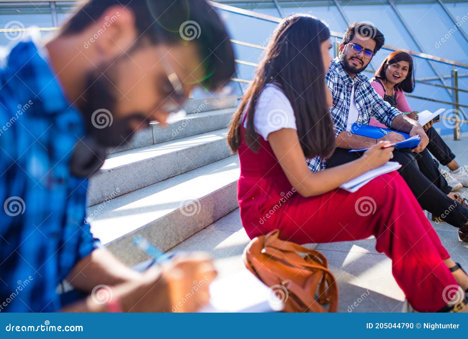 Indian Students Keeping Distance and Do Home Work Outdoors Stock Photo ...