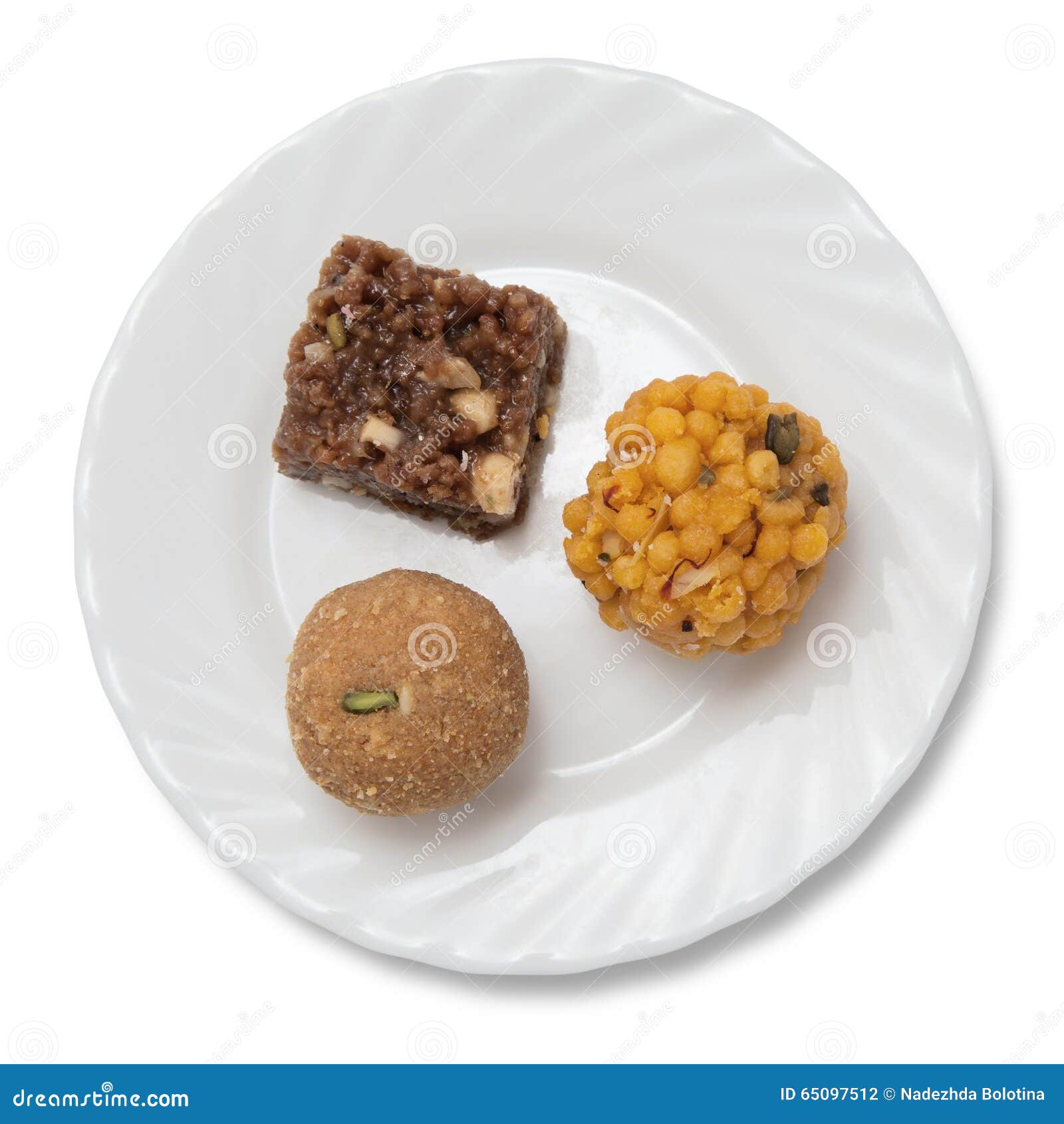 Indian sweets on a plate stock photo. Image of dairy - 65097512