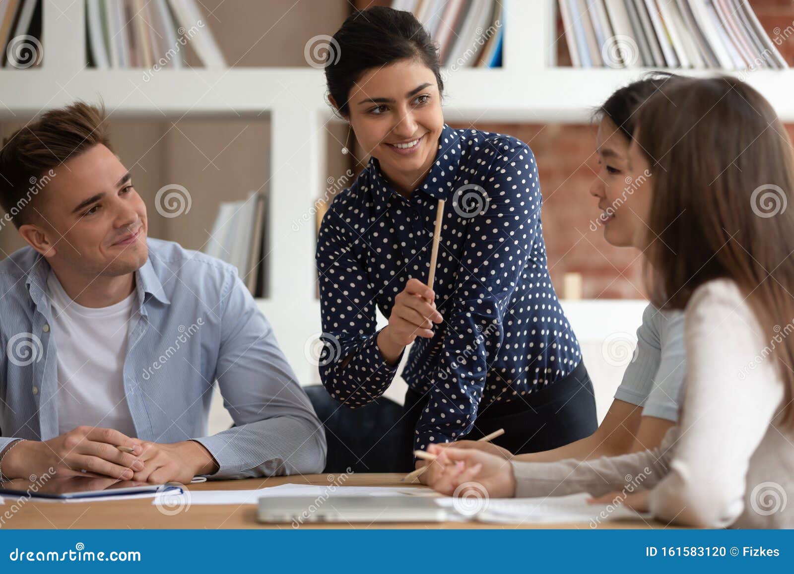 Indian Teacher Explain Educational Material To Multinational Group of ...