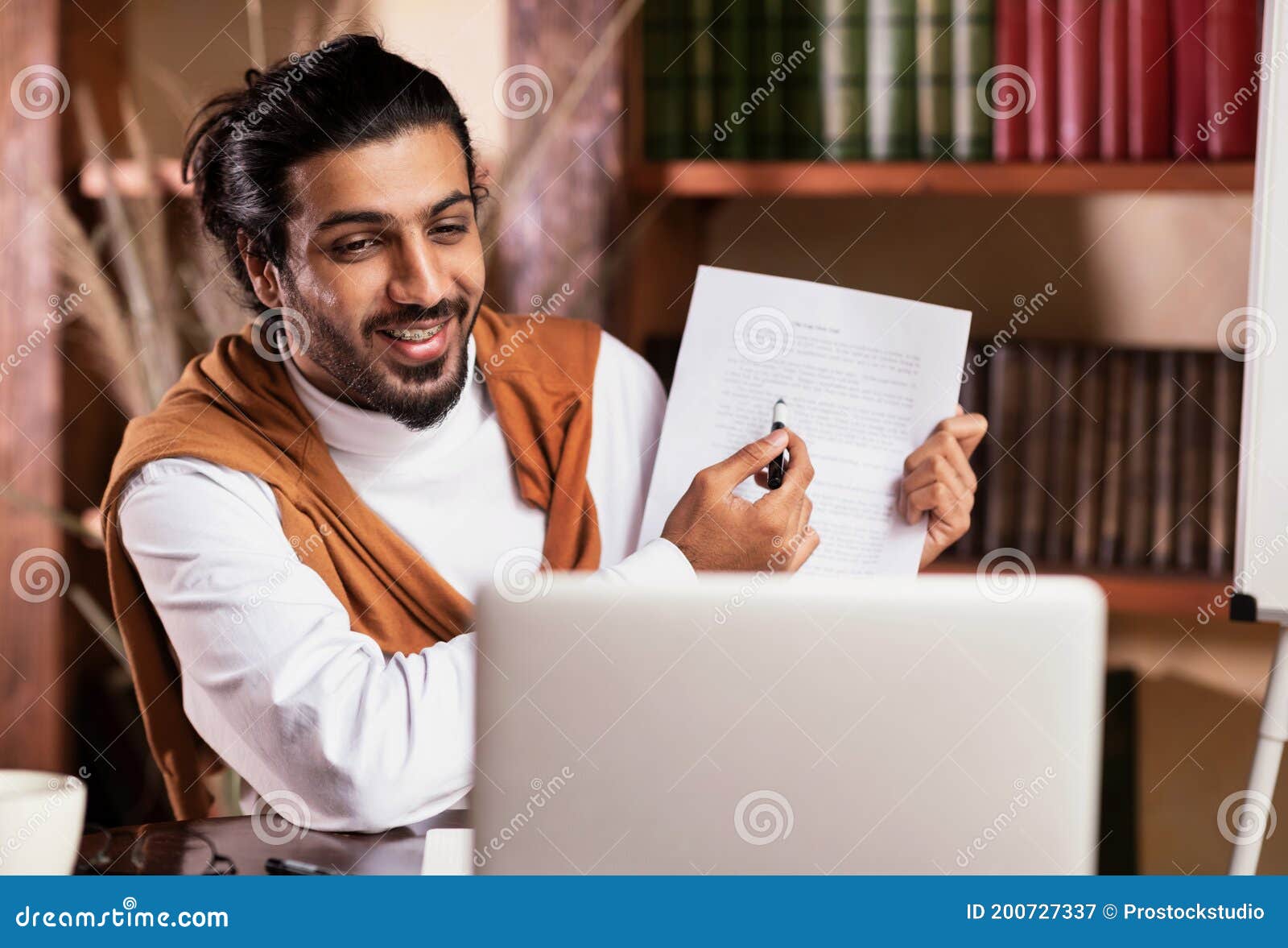 Indian Teacher at Laptop Having Class Teaching Online Sitting Indoors ...