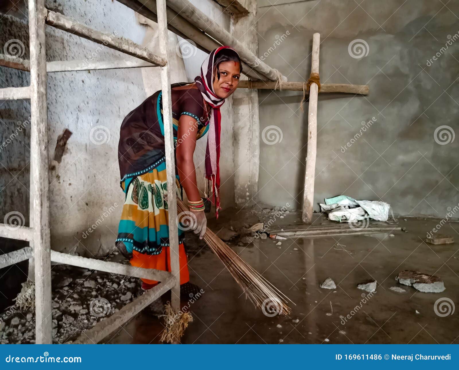 An Indian Village Lady Labour Cleaning Floor at Construction Site in ... An Indian Village Lady Labour Cleaning Floor at Construction Site in ...
