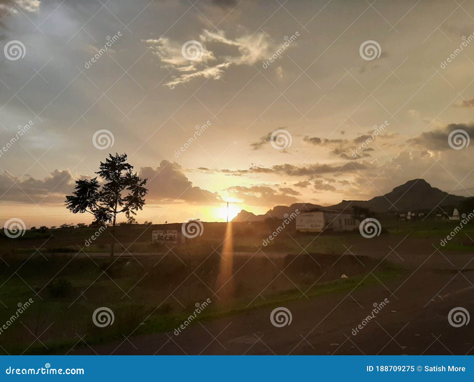 Indian village sunsets stock image. Image of hill, cloud - 188709275