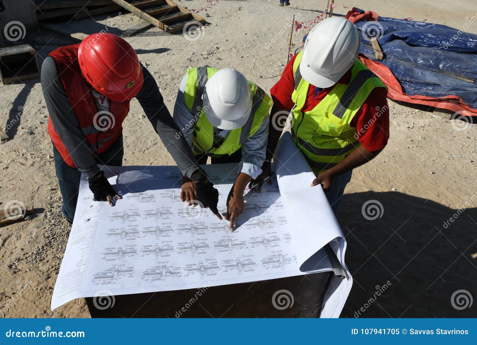 Indian Men Workers Unload The Boat With Sand By Manual Labor On The ...