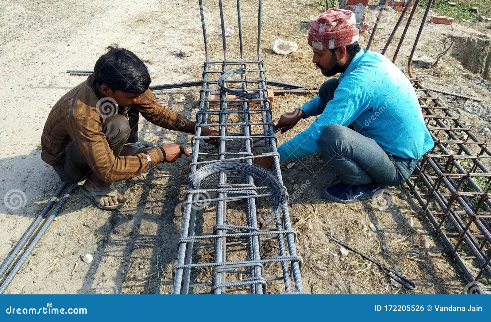 Indian Workers.Two Workers Checking the Durability of the Steel ...