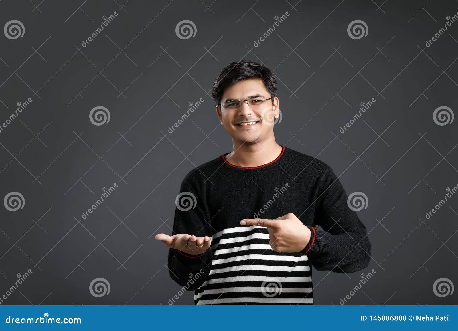 Indian Young Man Showing Direction with Hand Stock Photo - Image of ...