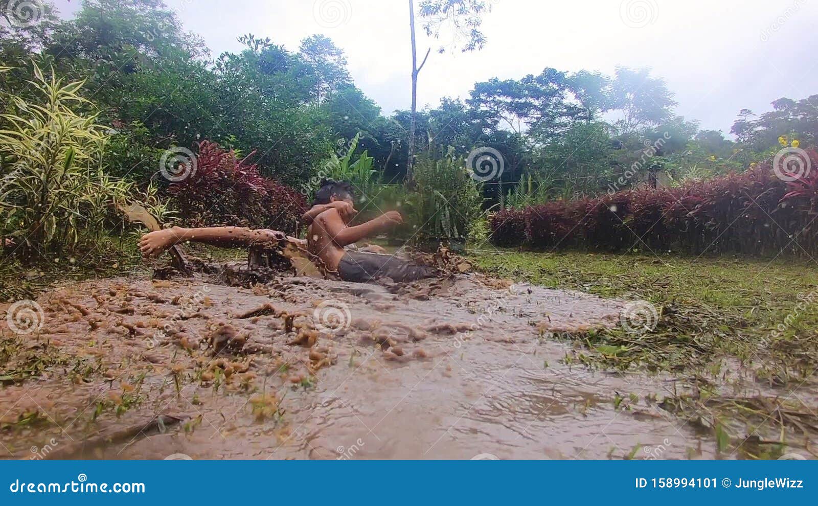 Indigenous Kids Wrestling in a Puddle in an Amazon Village Stock Video ...