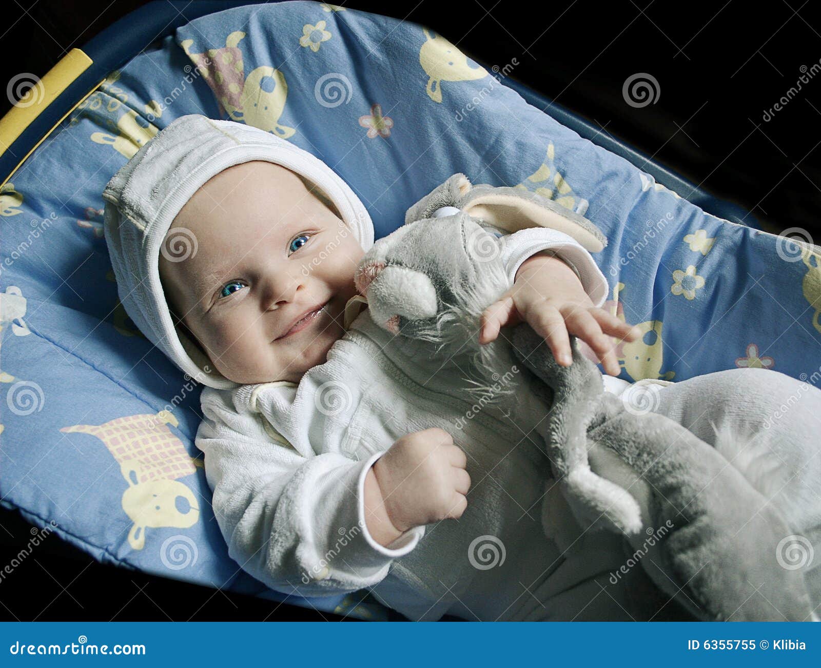 Indigo Baby with a Toy Rabbit Stock Image - Image of adorable, good ...