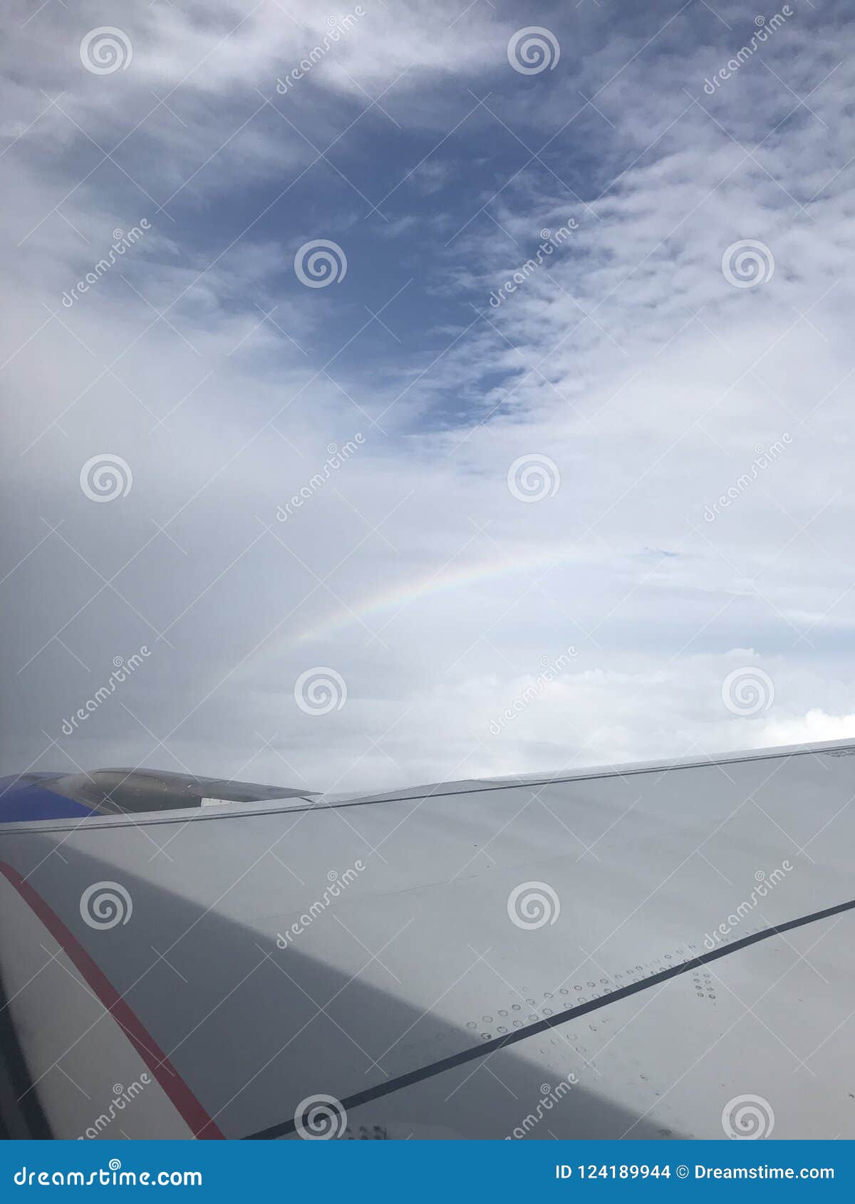 Wings through sky rainbow stock photo. Image of indigo - 124189944