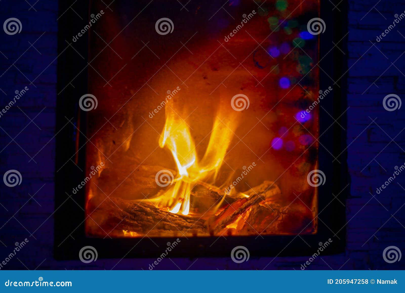 Indistinct Burning Fire in the Fireplace through the Fire Glass with ...