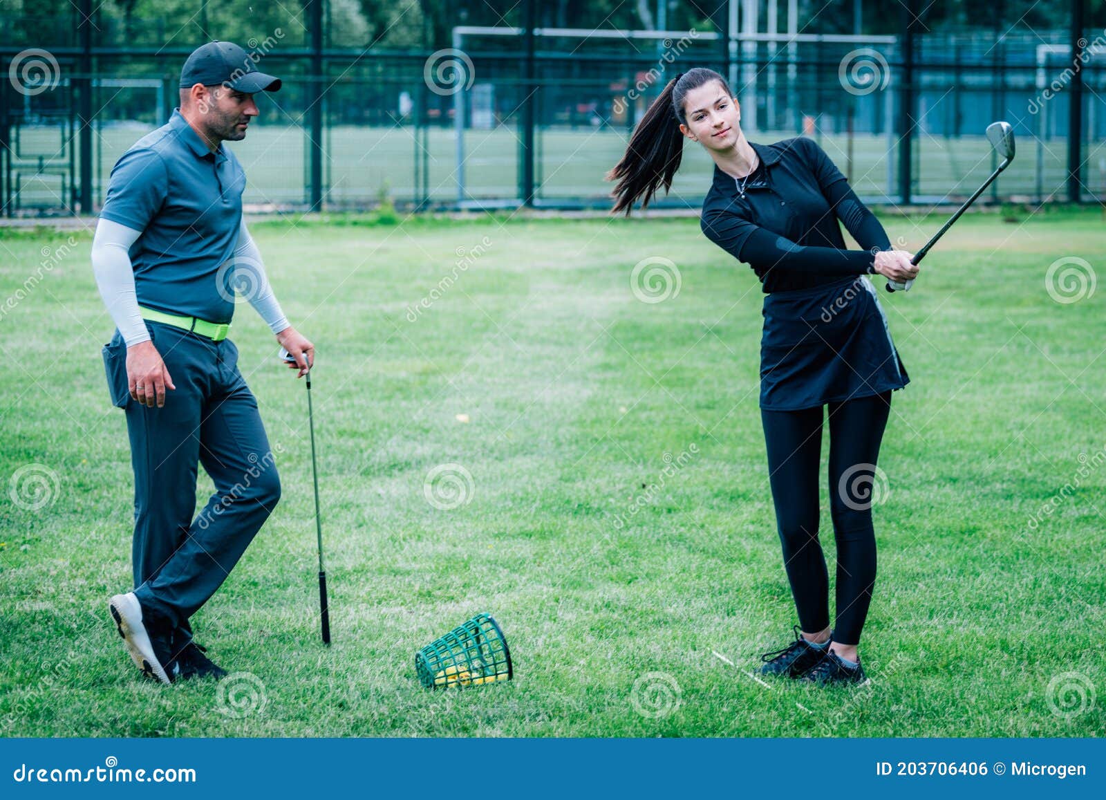 Individual Golf Lesson. Young Woman Having a Golf Lesson with Golf ...