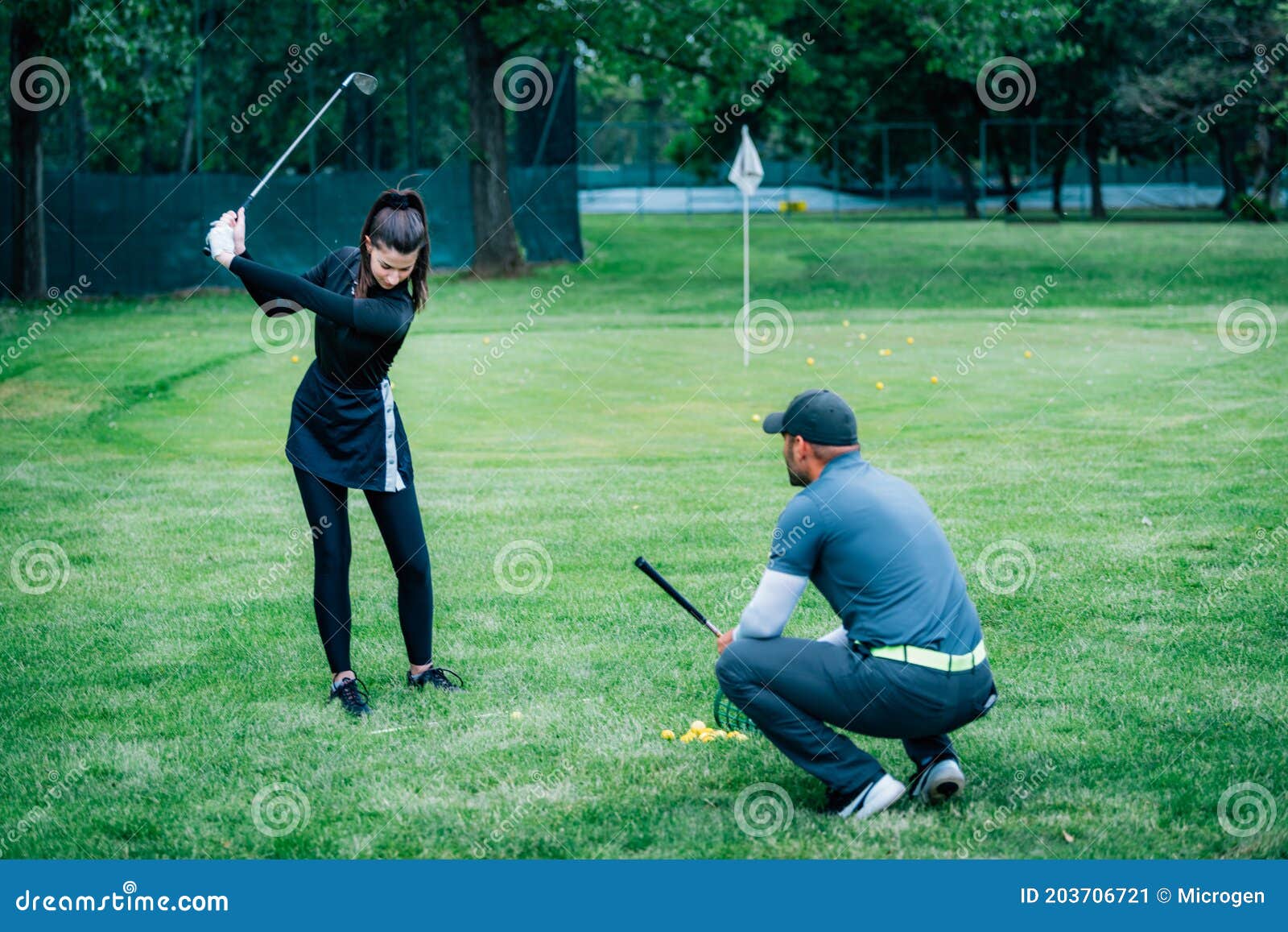 Individual Golf Lesson. Young Woman Having a Golf Lesson with Golf ...