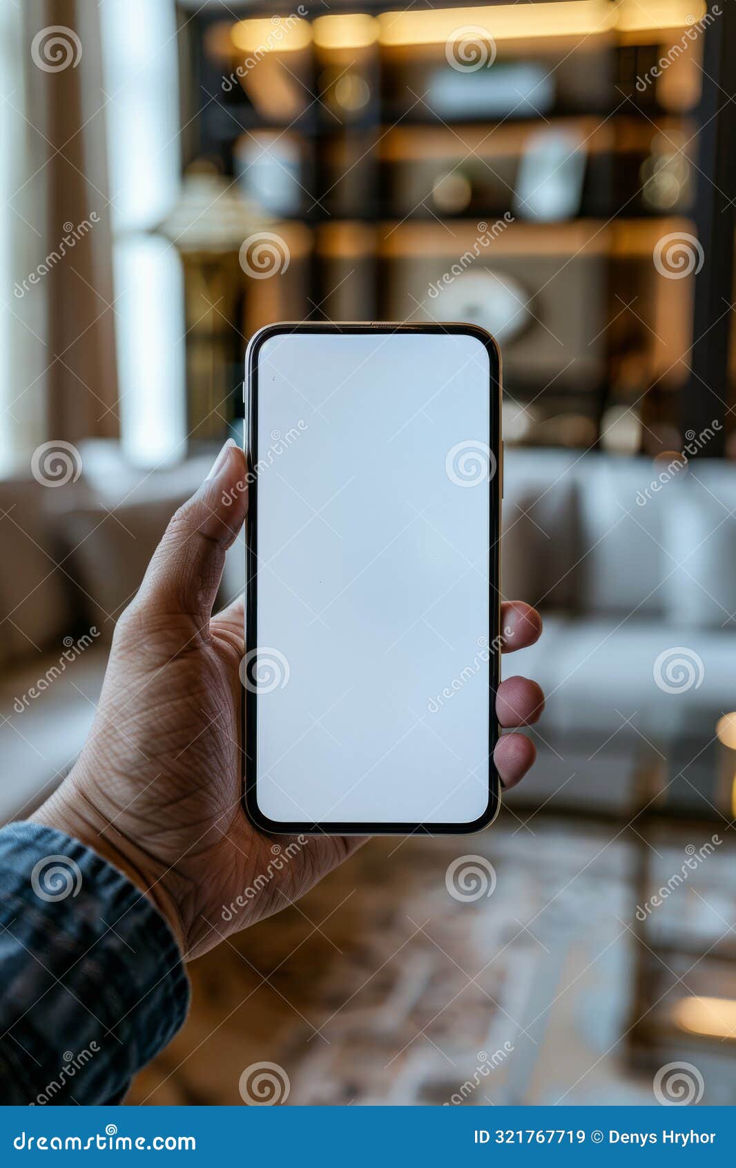 An Individual Hand Holding a Blank White Smartphone with an Empty ...