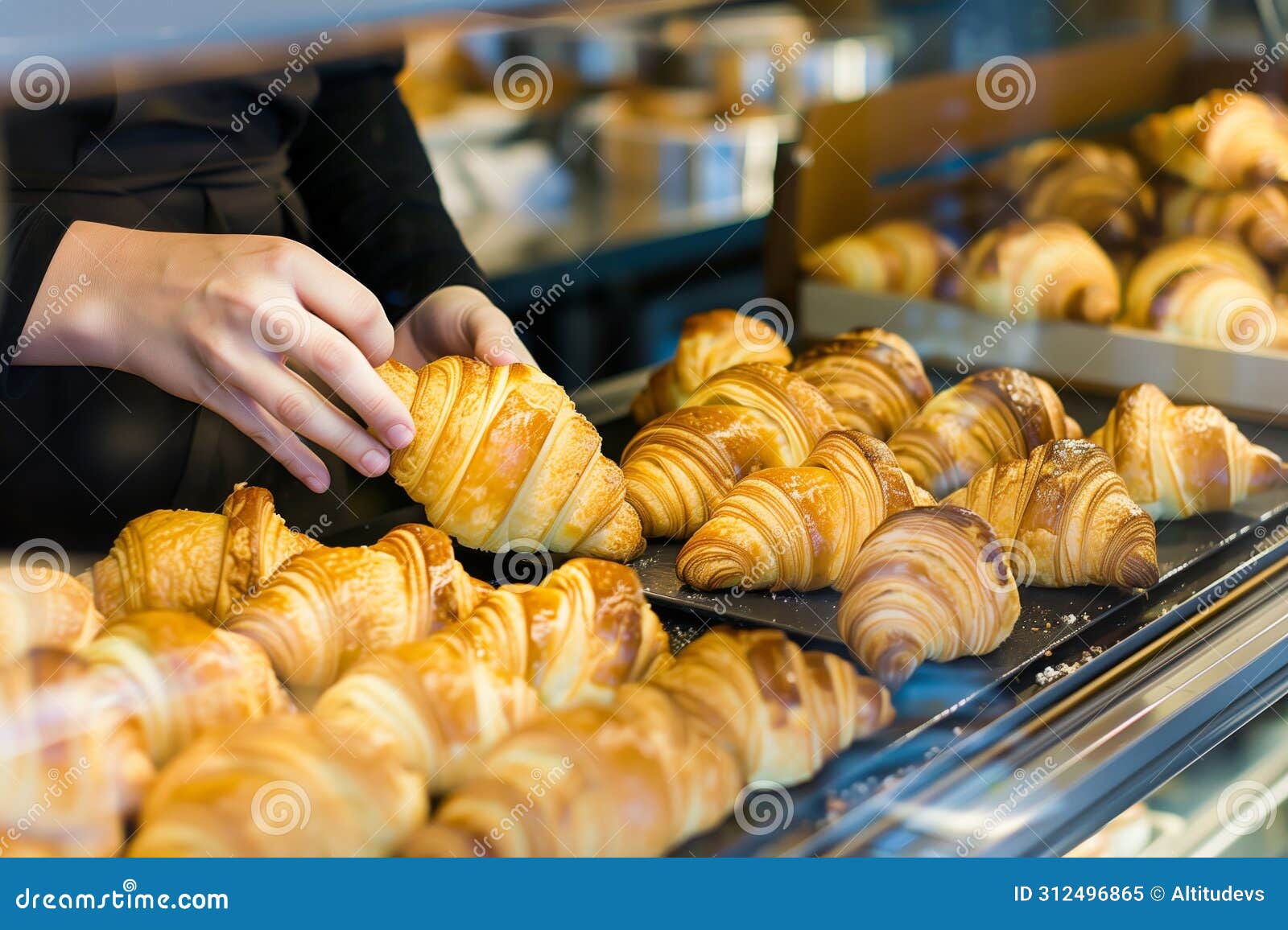 Individual Placing Croissants in Display Case Stock Image - Image of ...