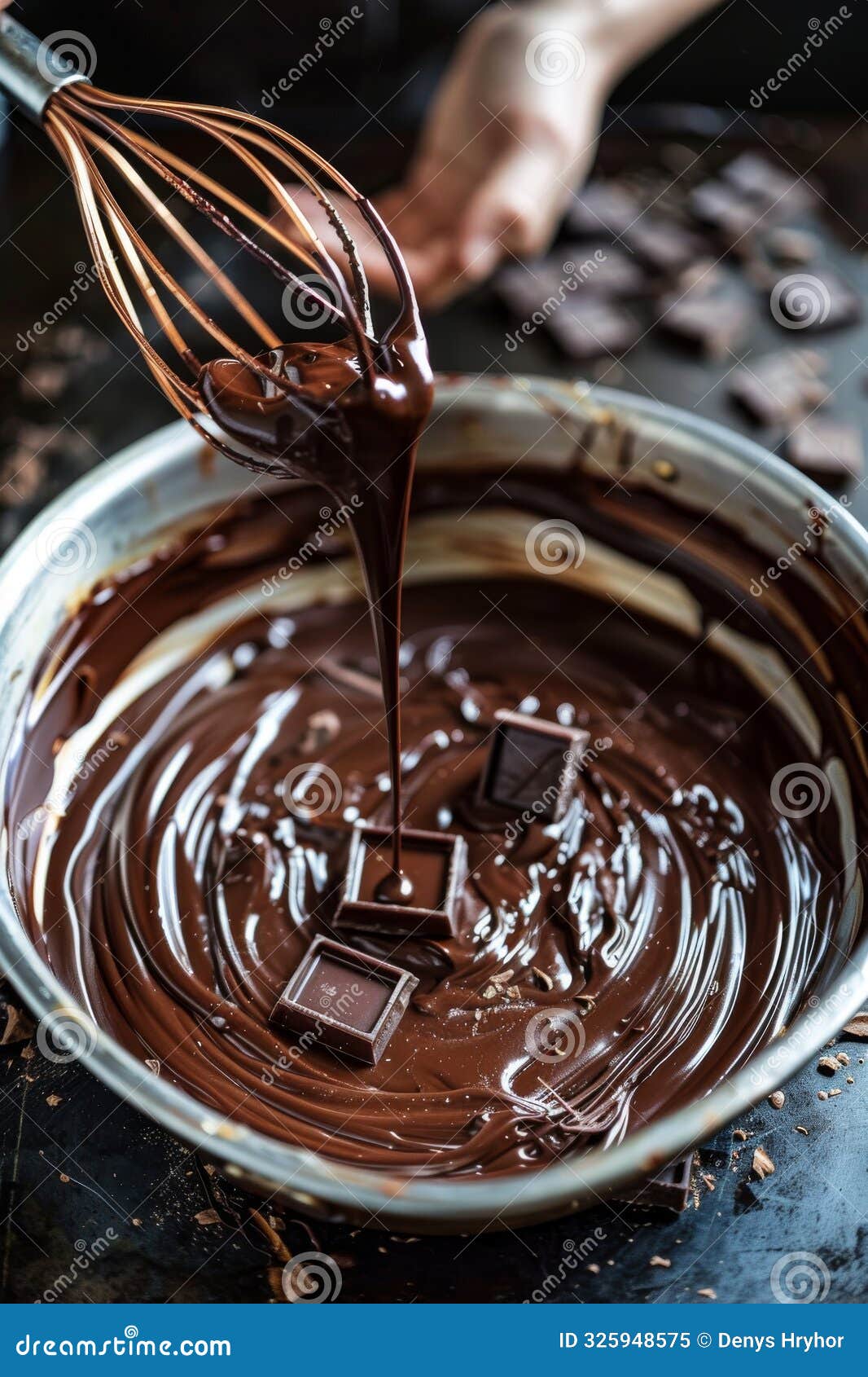 An Individual Pouring Melted Chocolate from a Pot into a Bowl Stock ...