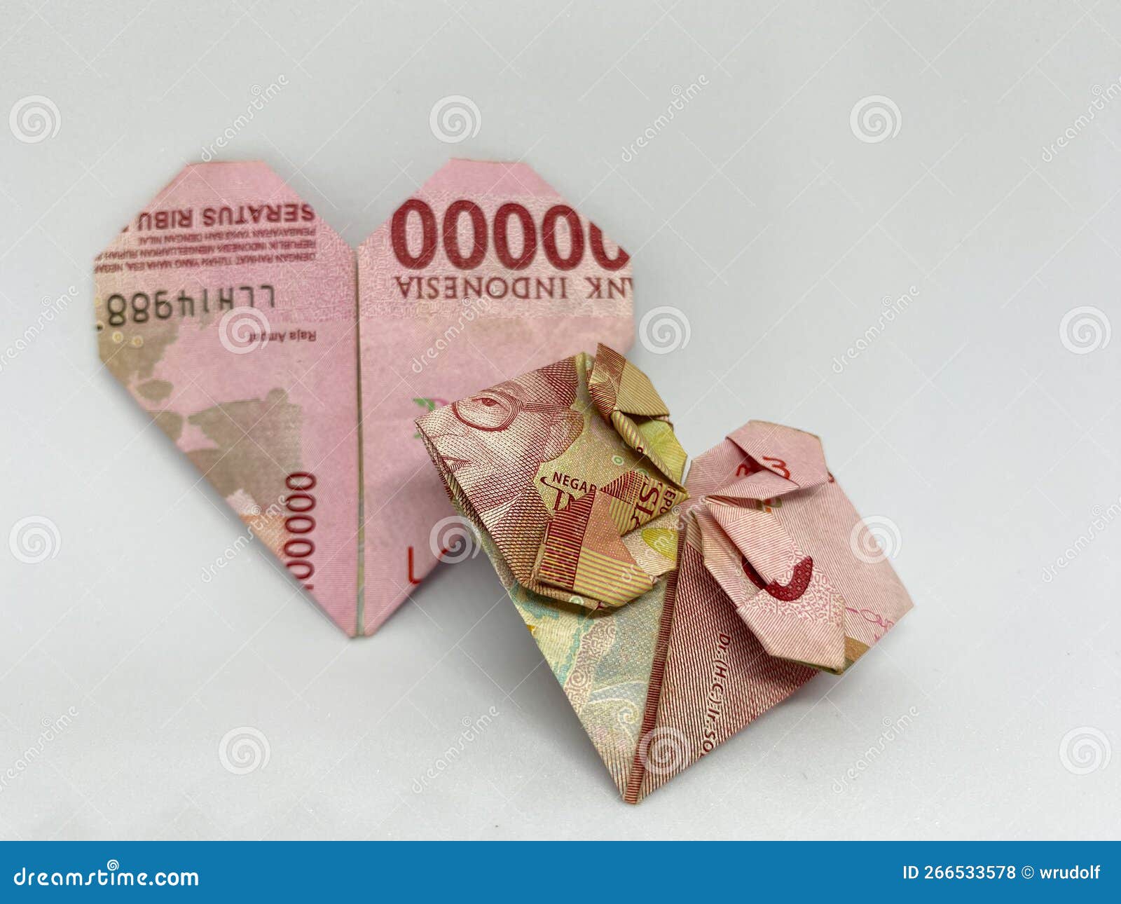 Indonesian Banknotes 100000 Rupiah Folded Heart Shape Isolated on White ...