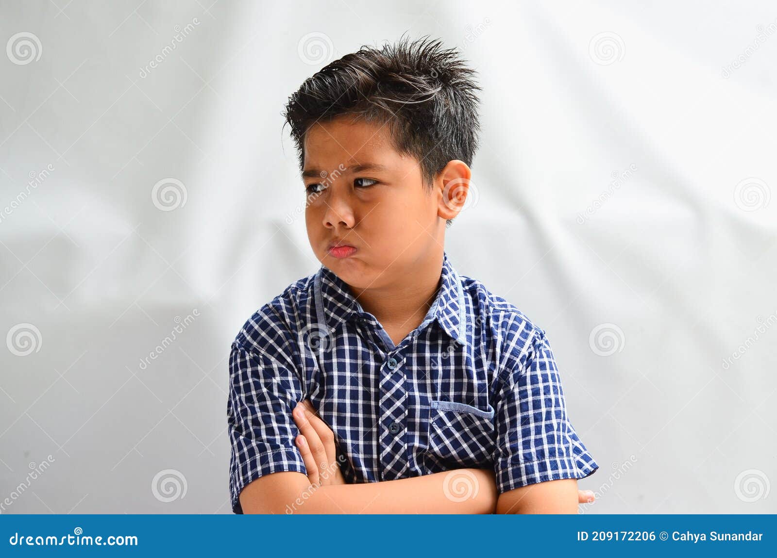 Indonesian Boy with Sad Expression Stock Photo - Image of clothing ...