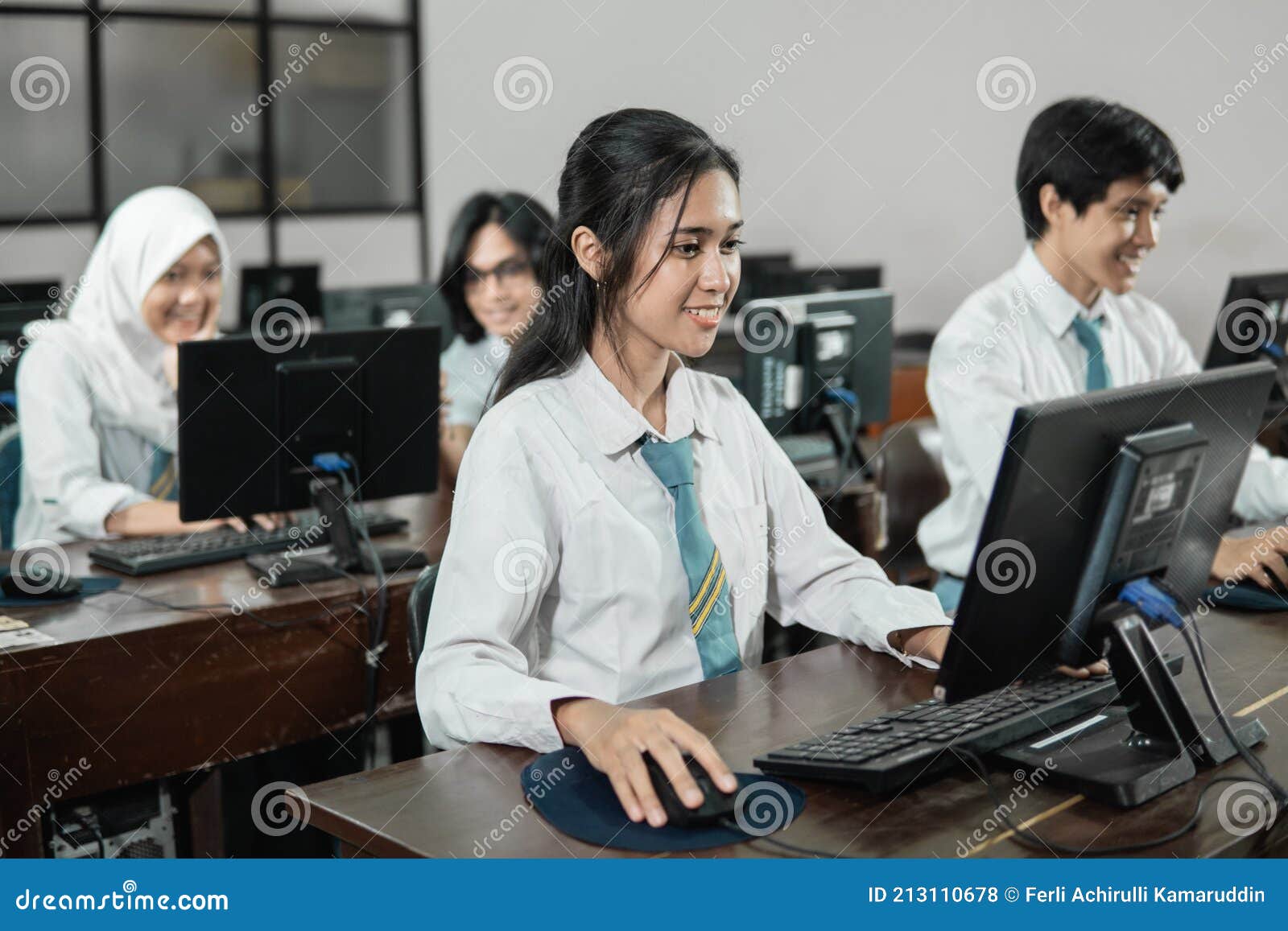 Indonesian Female High School Students Smile while Using a Computer PC ...