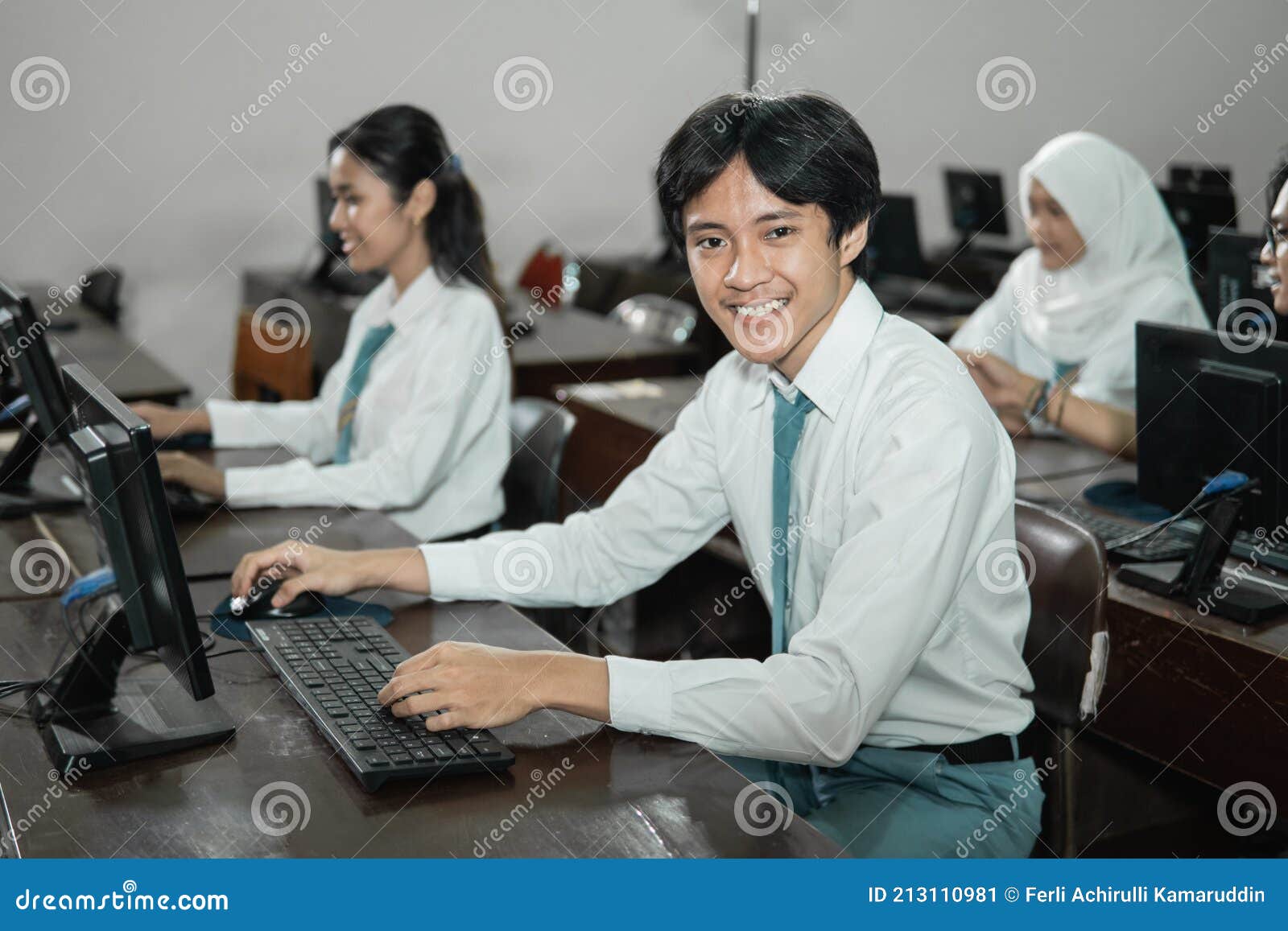 Indonesian High School Students Smile Looking at the Camera while Using ...