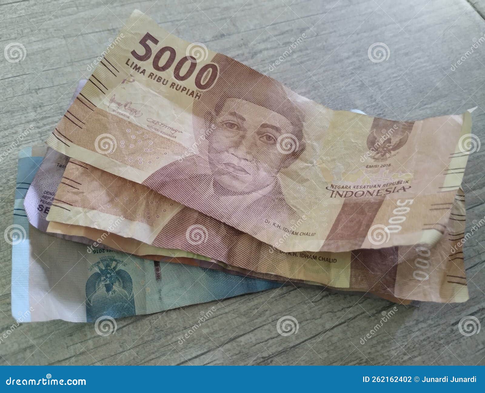 Indonesian money Rupiah stock photo. Image of wood, banknote - 262162402