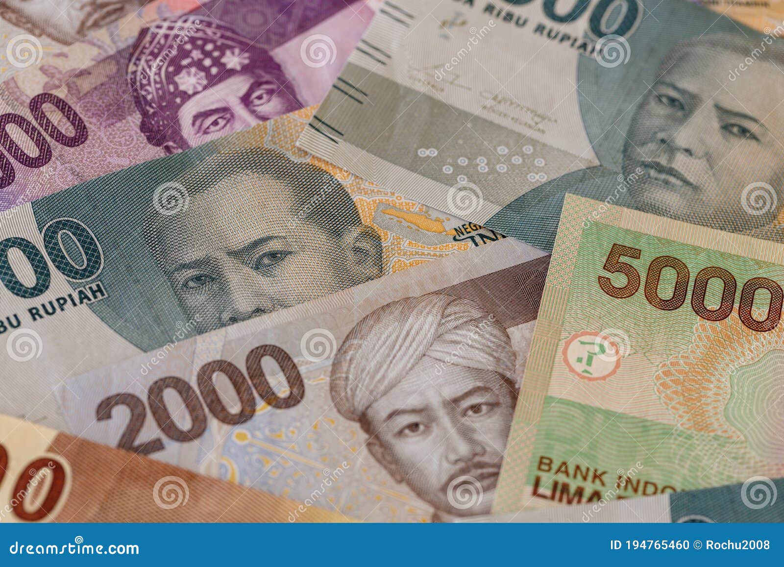 Indonesian Rupees, New, Different Denominations Scattered on the Table ...