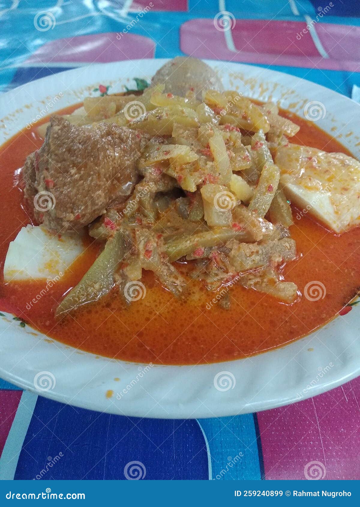 Indonesian Traditional Street Food with Spicy Sauce, Lontong Sayur ... Indonesian Traditional Street Food with Spicy Sauce, Lontong Sayur ...