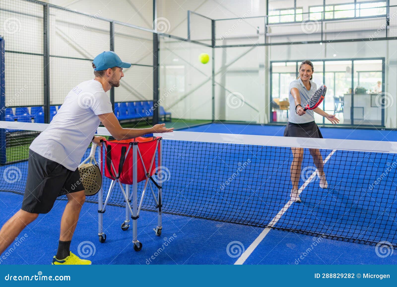 Indoor Padel Training: Coach and Female Player Techniques Stock Photo ...