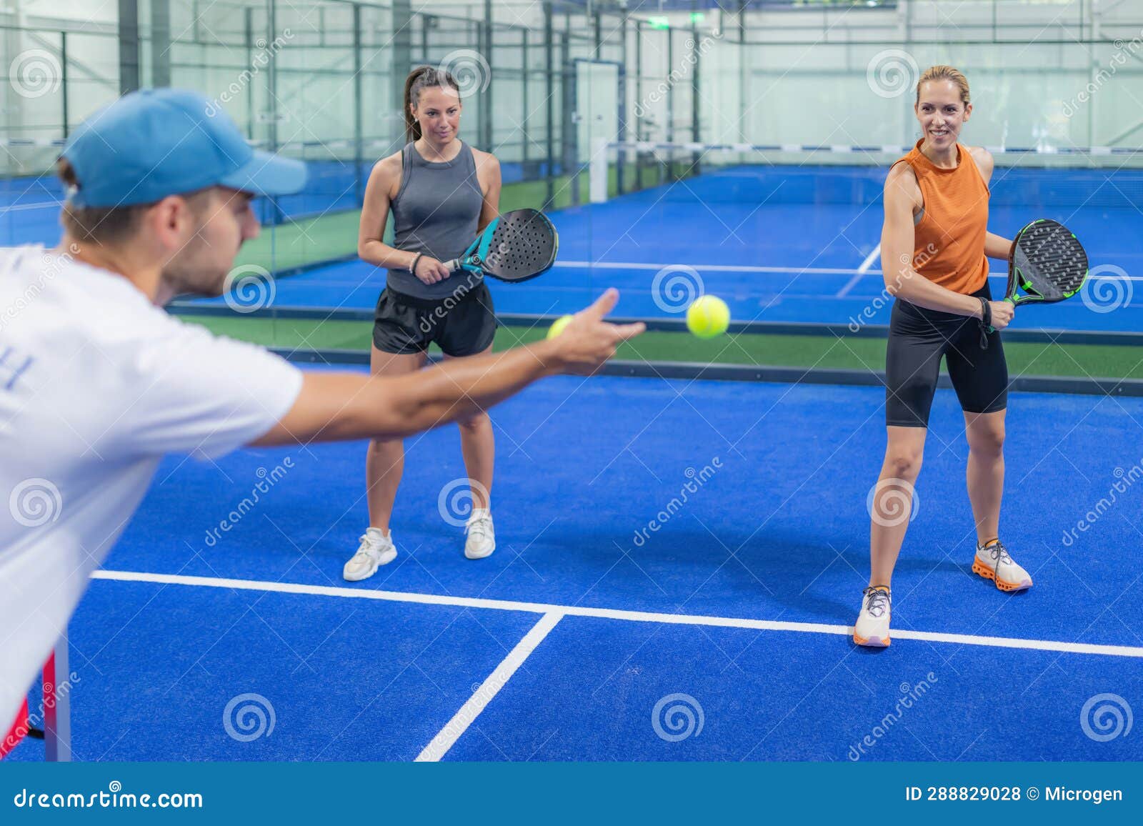Indoor Padel Training: Partnered Skill Development Stock Photo - Image ...