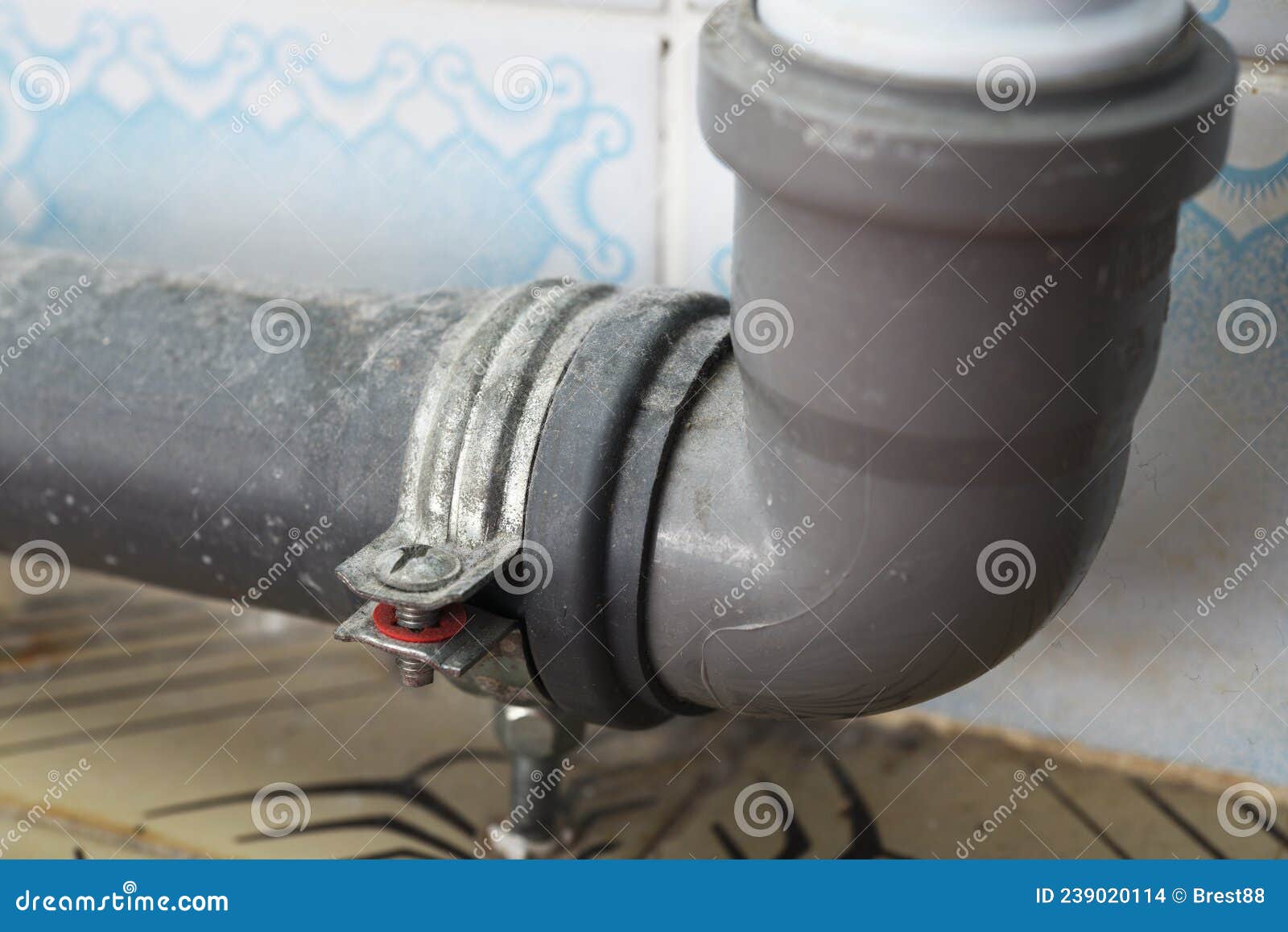 Indoor Plastic Sewer Pipe with Fixing for Floor and Wall. Stock Photo ...