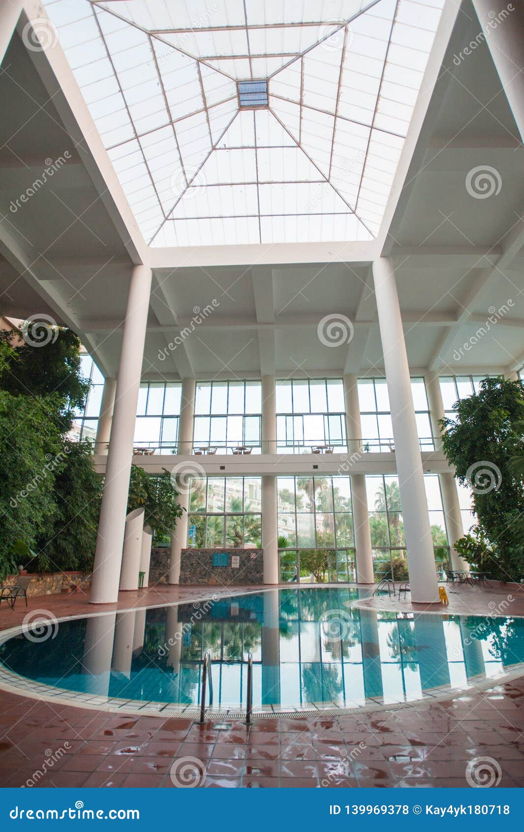 Indoor Pool with White Columns and Foliage Stock Photo - Image of ...