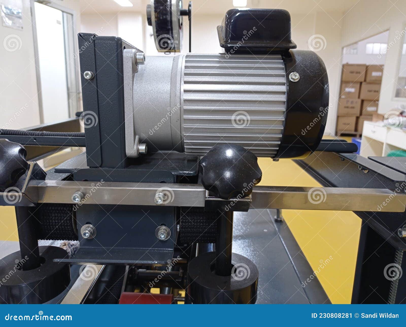 Induction Motor with Gearbox is the Driving Force in a Machine Stock ...