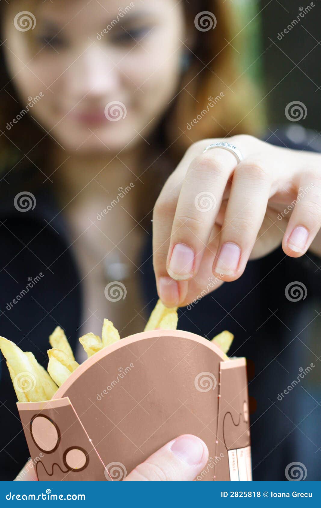 Indulging in french fries stock photo. Image of pick, french - 2825818