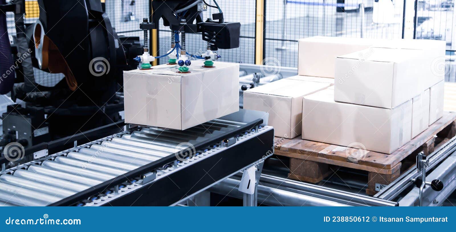 Industrial Autonomous Robot Loading Carton on Conveyor Stock Photo ...