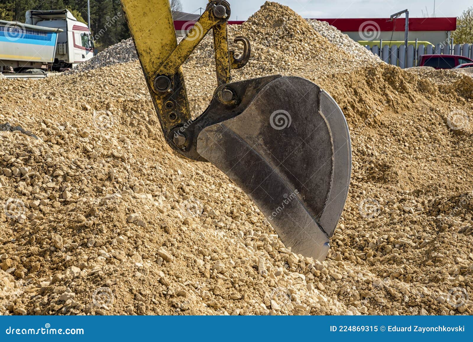 Close Up Of Excavator Bucket Scooping Gravel From In The Building ...