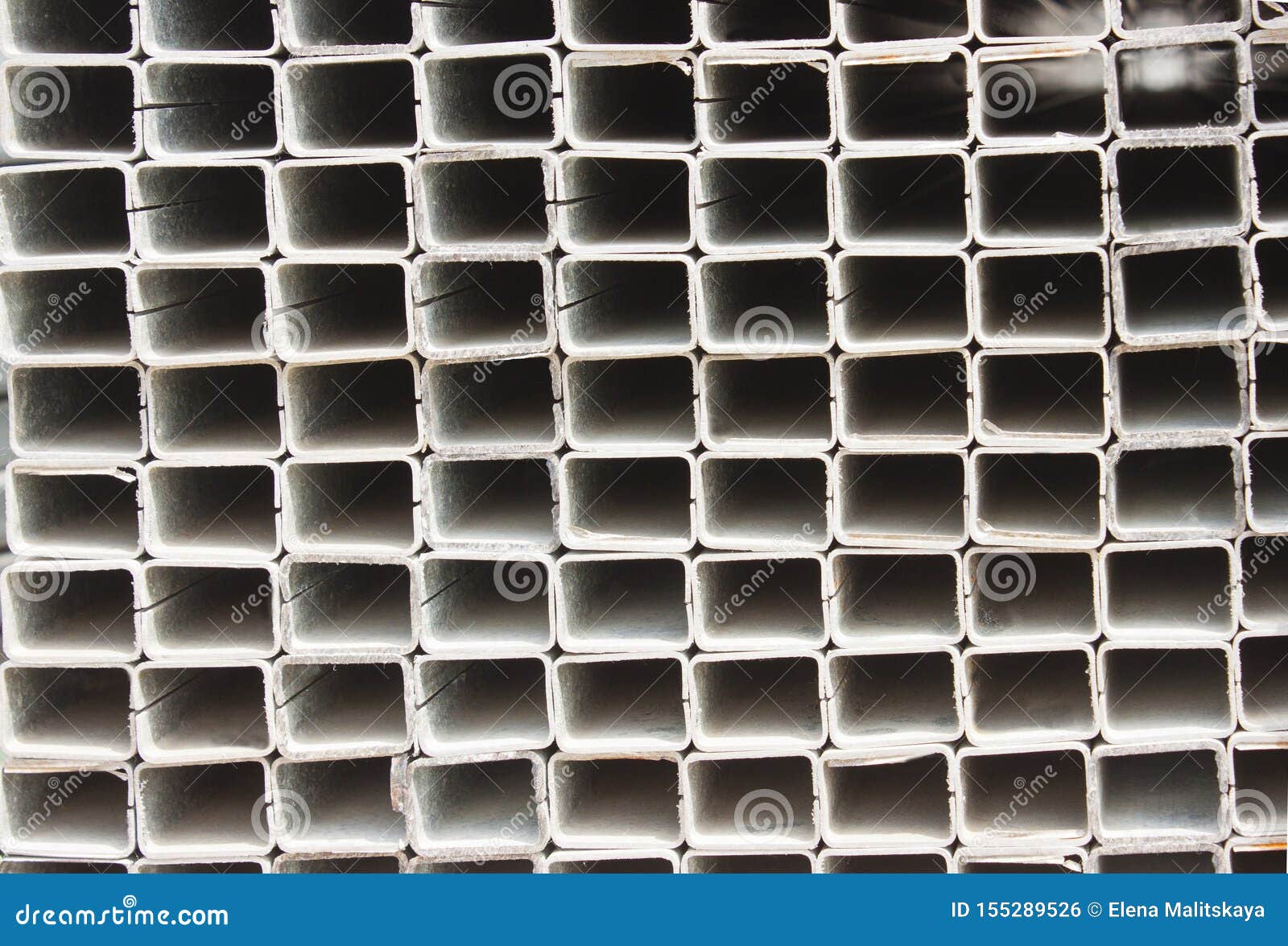 Industrial Background. Pile of Metal Profile in a Warehouse Stock Photo ...