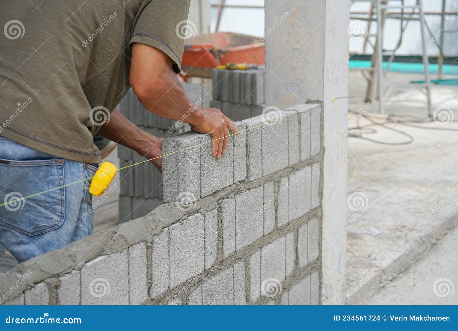 Industrial Bricklayer Installing Brick Blocks on Construction Site ...