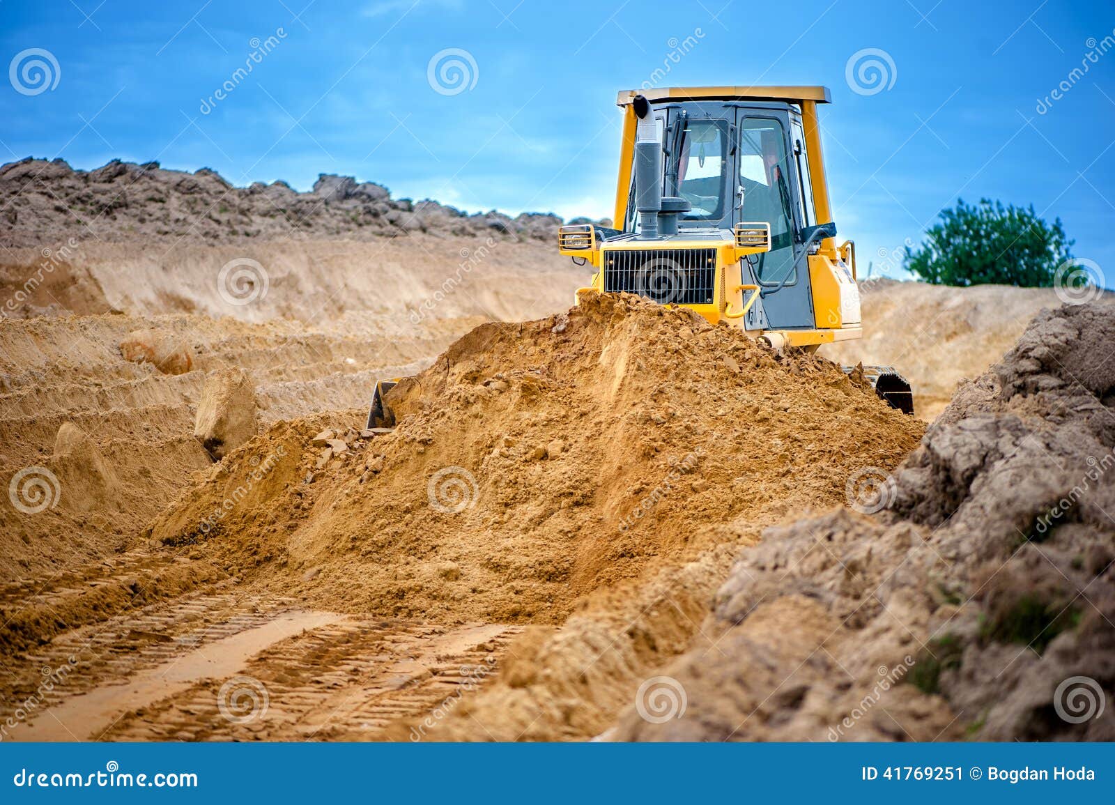 Industrial Bulldozer Or Tractor Loader With Raised Bucket At ...