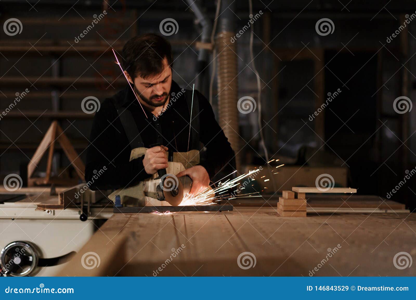 Industrial Carpenter Worker Cutting Metal with Many Sharp Sparks at a ...