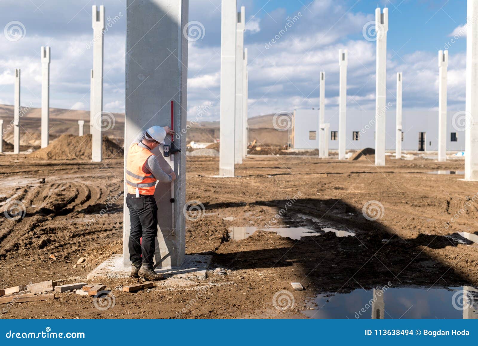 Industrial Civil Engineer Working on Construction Site. Professional ... Industrial Civil Engineer Working on Construction Site. Professional ...