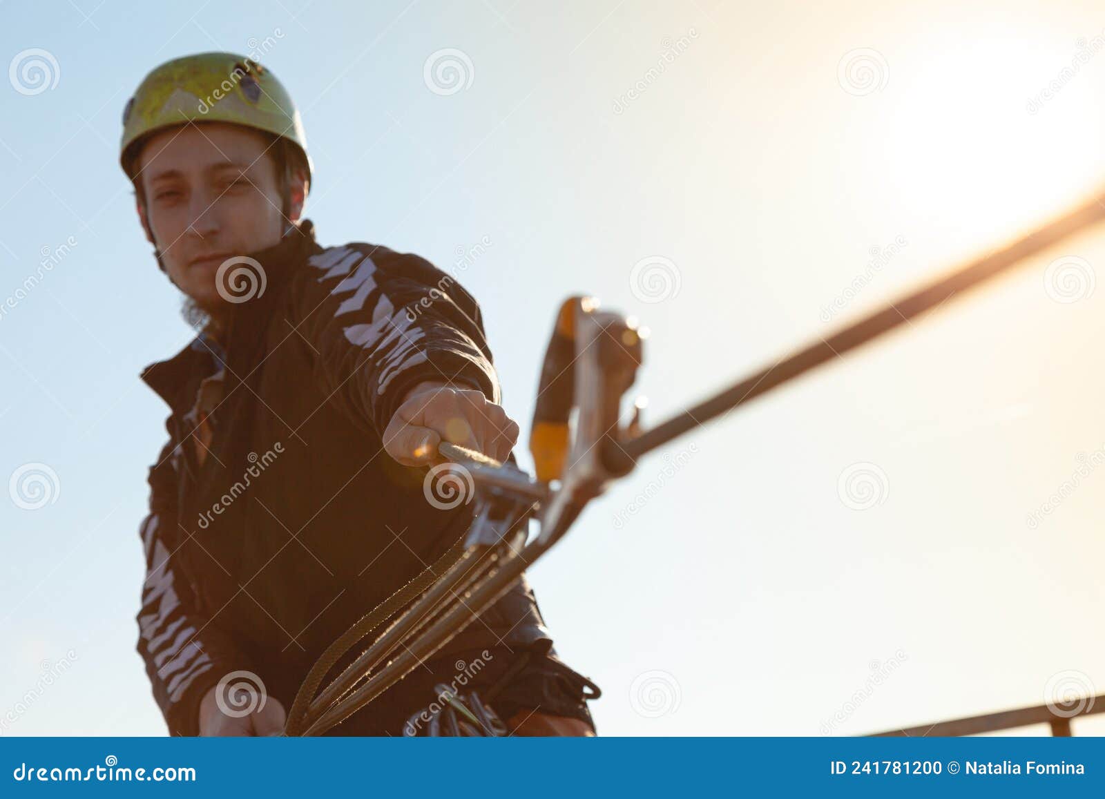 An Industrial Climber Pulls a Rope with a Trigger Device Stock Photo ...